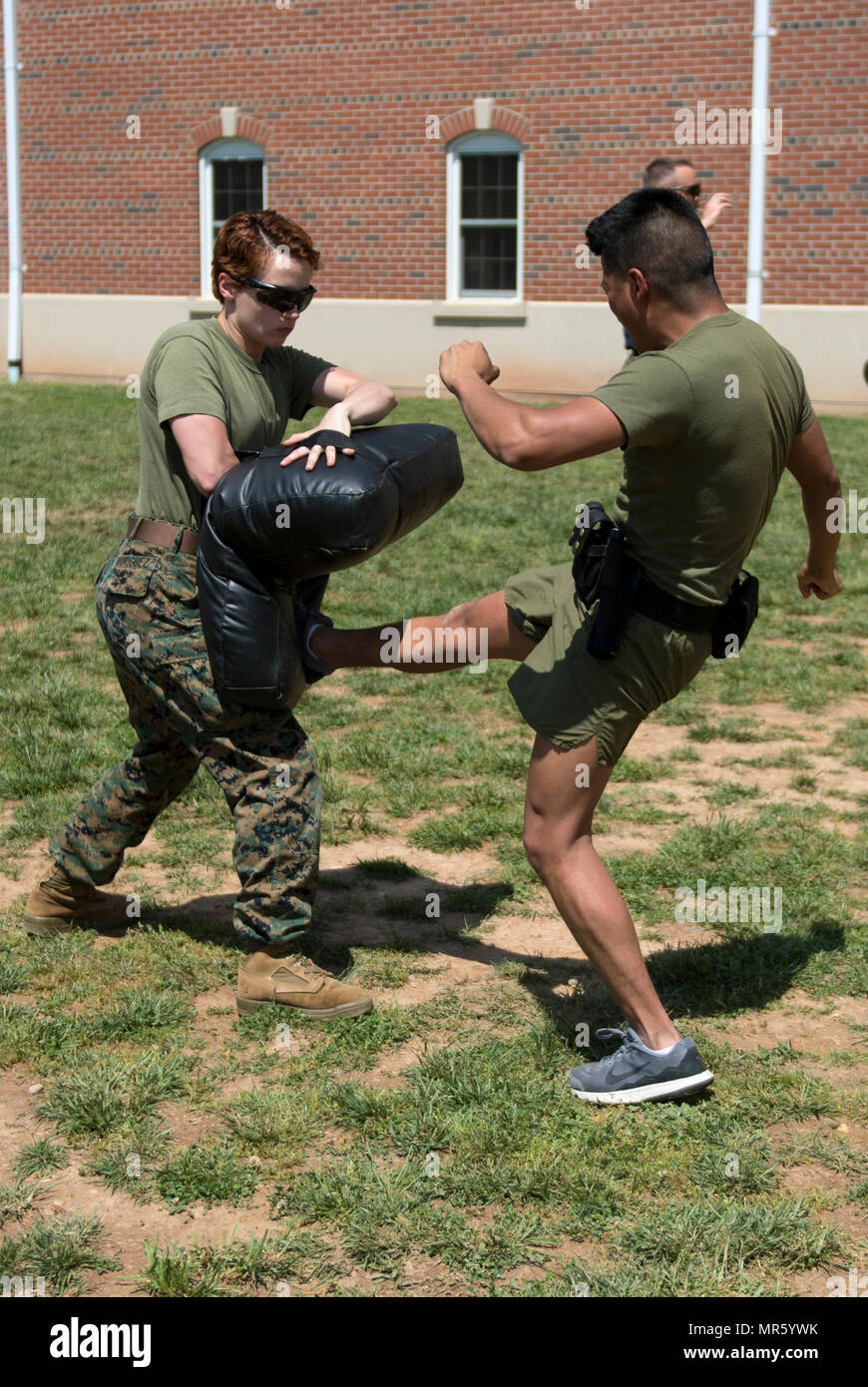 A U.S. Marine student with Marine Corps Embassy Security Group kicks a ...