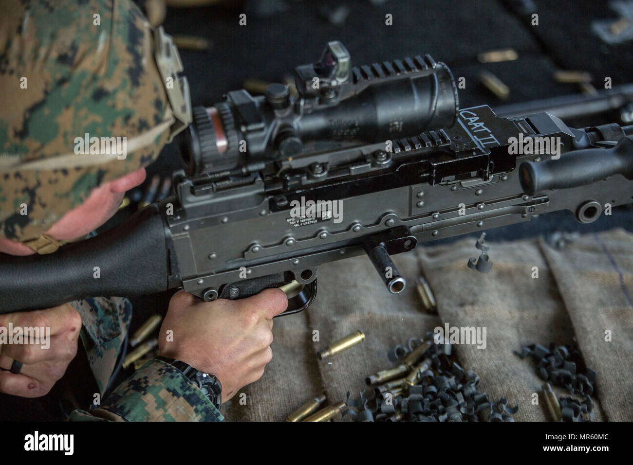Sgt. Bryan Stiles calibrates the sights on his M240G machine gun, May ...