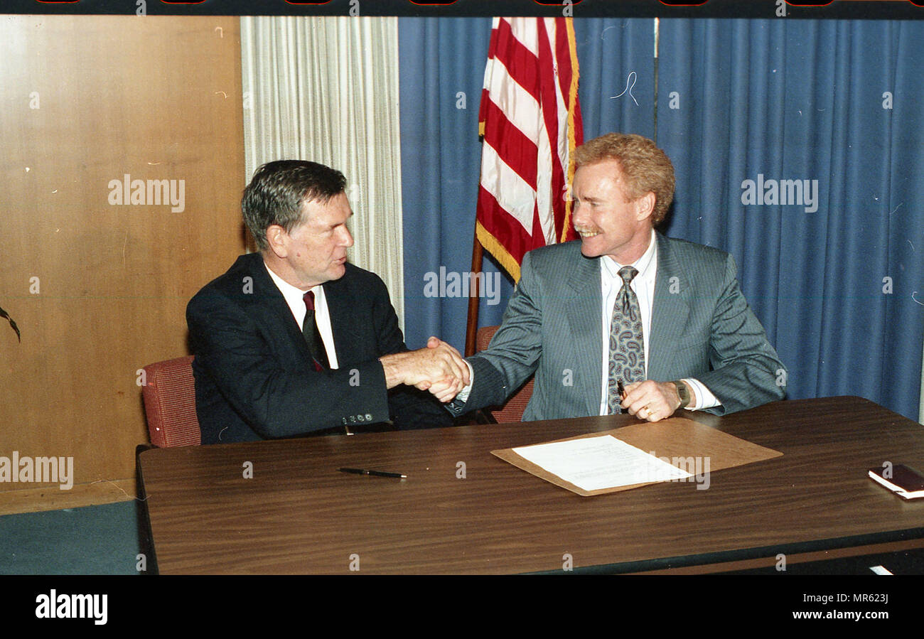 men shaking hands and talking Stock Photo - Alamy