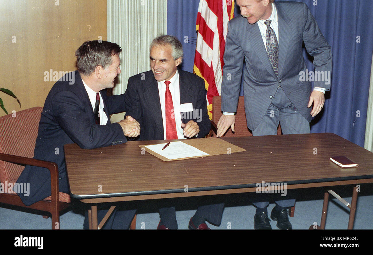 men shaking hands and talking Stock Photo - Alamy