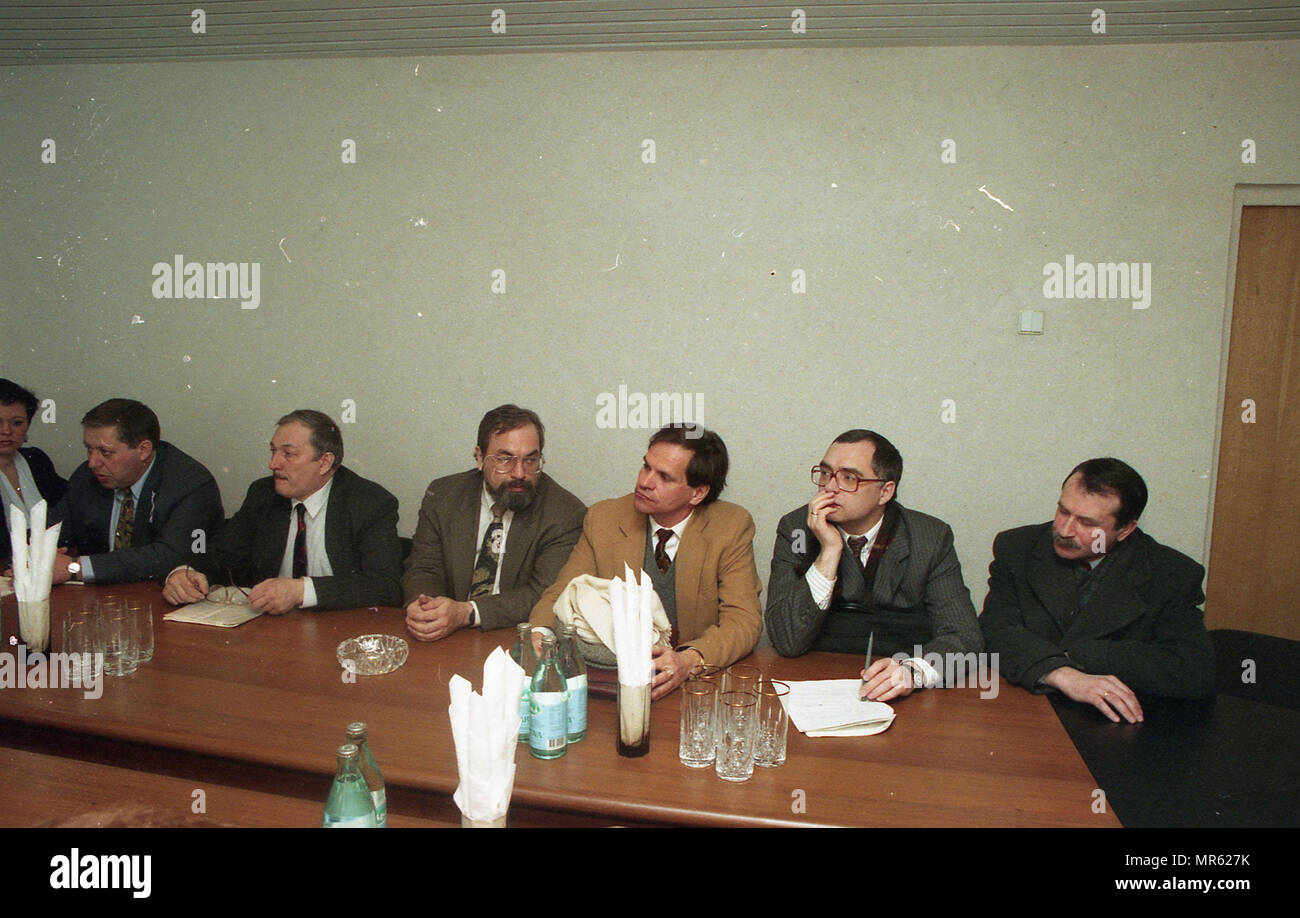 group of men sitting Stock Photo - Alamy
