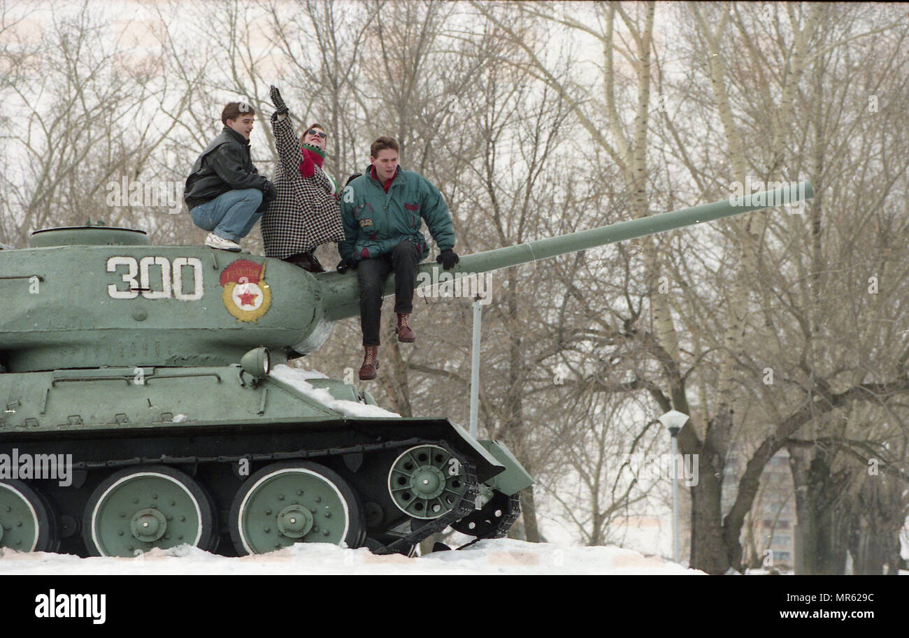 three people on tank Stock Photo - Alamy
