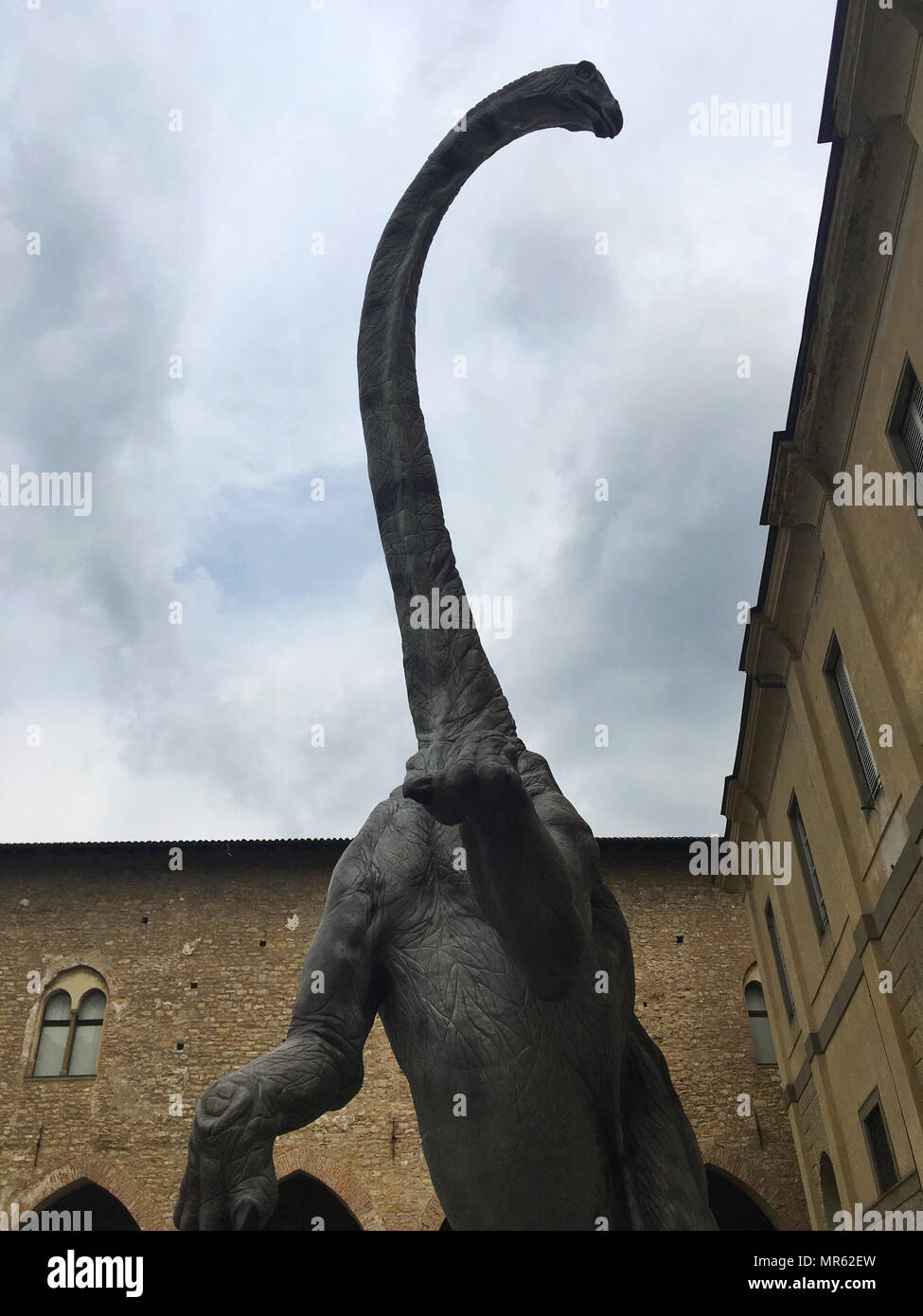Bergamo, Italy - 7 May, 2018: The statue of a dinosaur in Bergamo ...