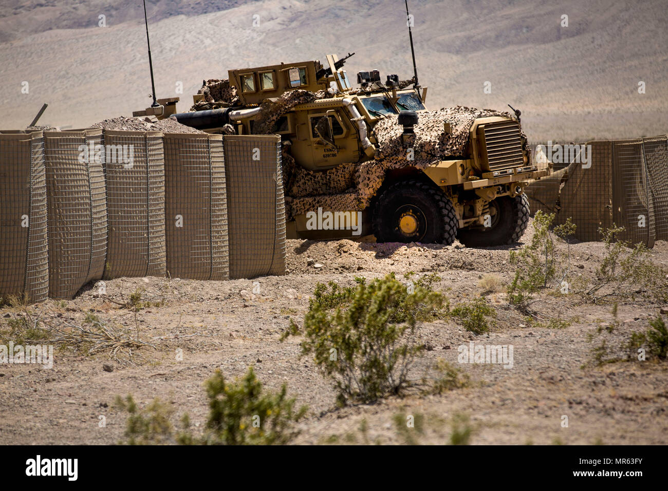 U.S. Marine Corps mine-resistant ambush-protected vehicle moves through ...