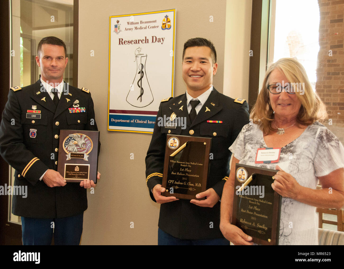 (From left) Lt. Col. Justin Orr, staff researcher of the year, Capt ...