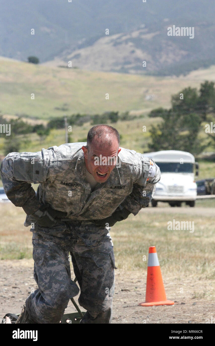 Nevada Army National Guardsman Sgt. Oswald Sanchez drags a 180-pound ...