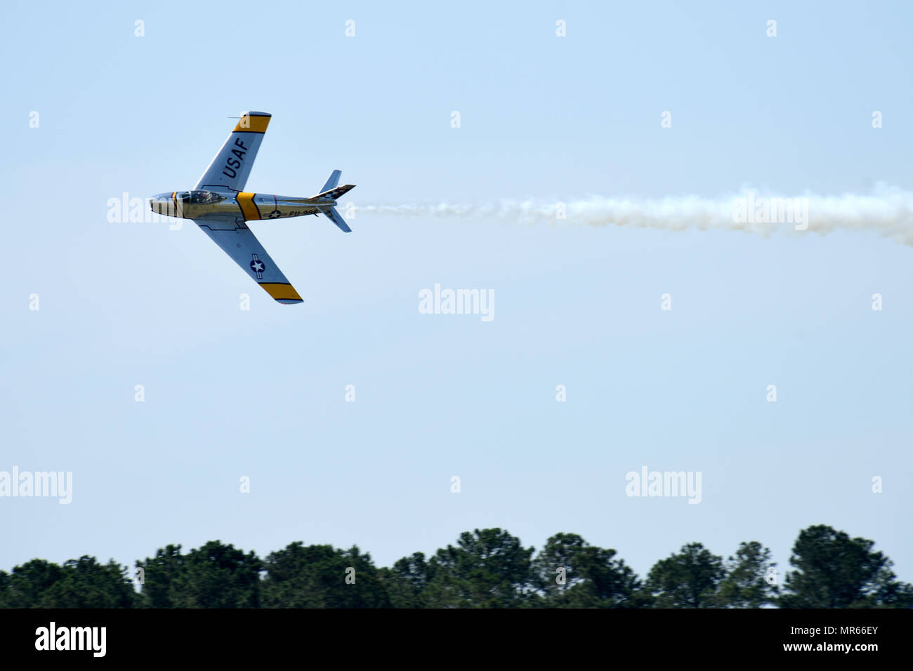 An F-86 Sabre jets across the sky during the Wings Over Wayne Air Show ...