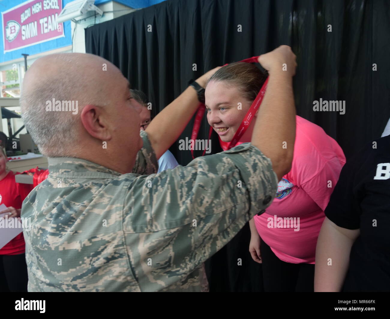 Col. Alan Chouest, 81st Training Wing wing chaplain, awards Jessica Thomas, Area 16 athlete, a ...