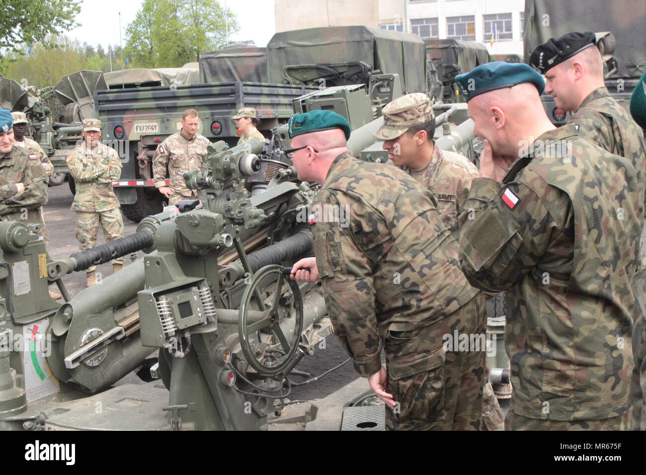 U.S. Soldiers from Battle Group Poland’s ready platoon show cadets and ...