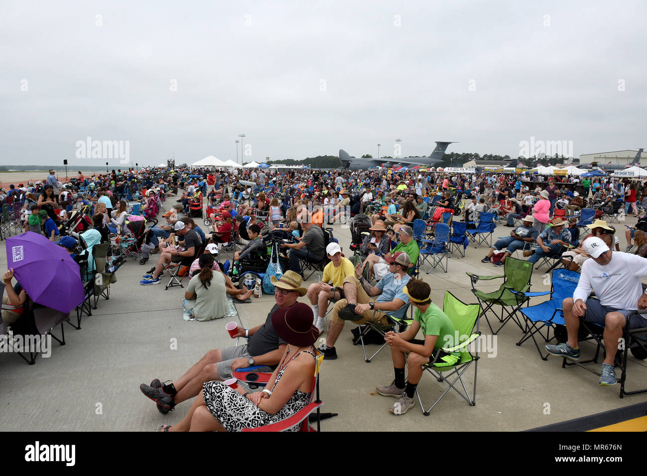 Spectators view multiple aircraft static displays and demonstrations ...