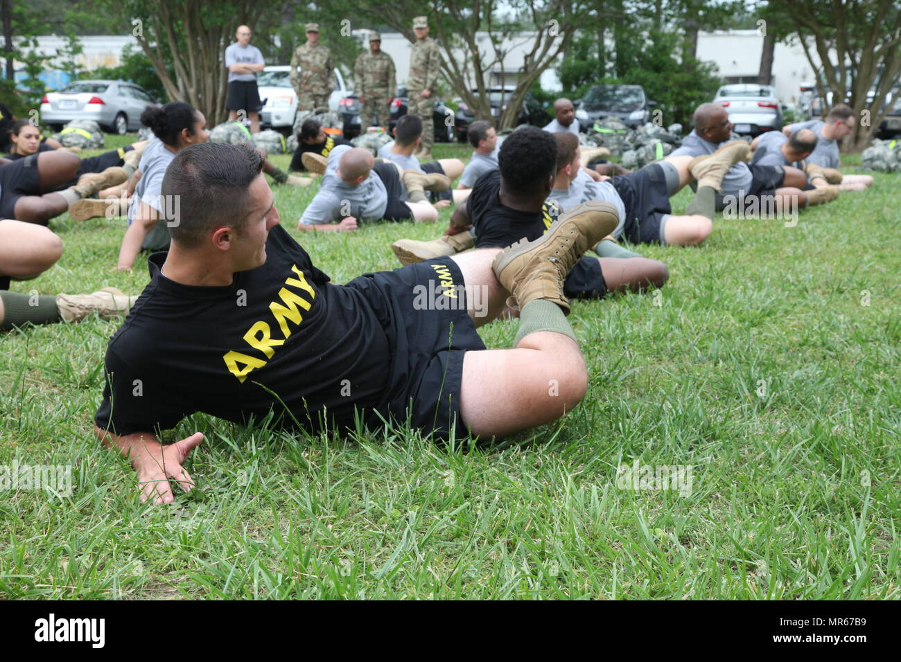 U.S. Army Pvt. Jacob Brantley conducts the Thigh Stretch after ...