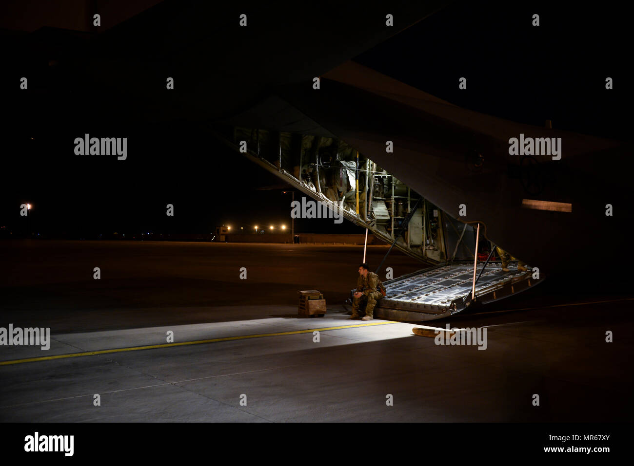 A pilot of the 774th Expeditionary Airlift Squadron sits on the loading ...
