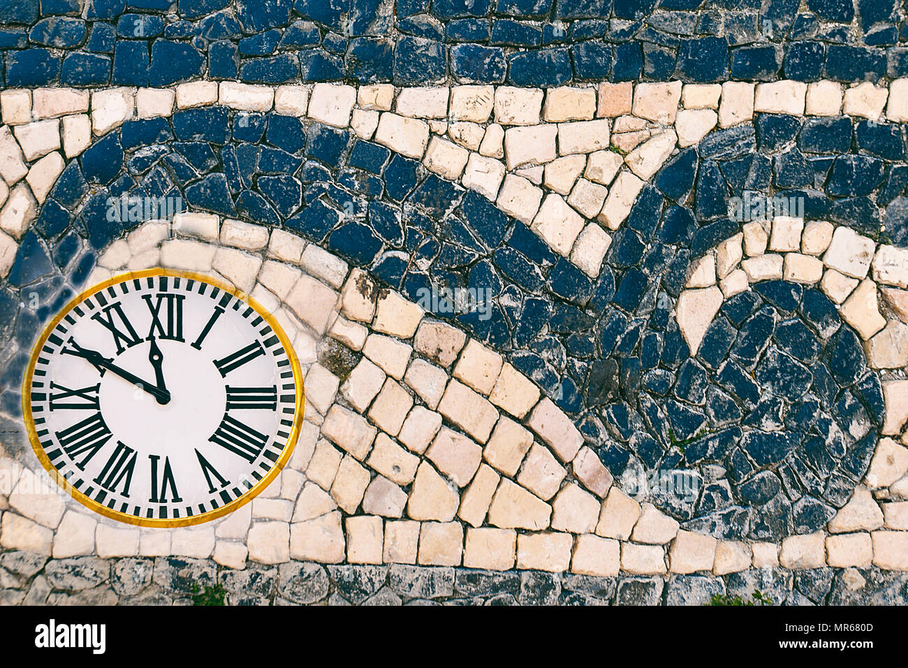 clock between mosaic-portugal Stock Photo - Alamy