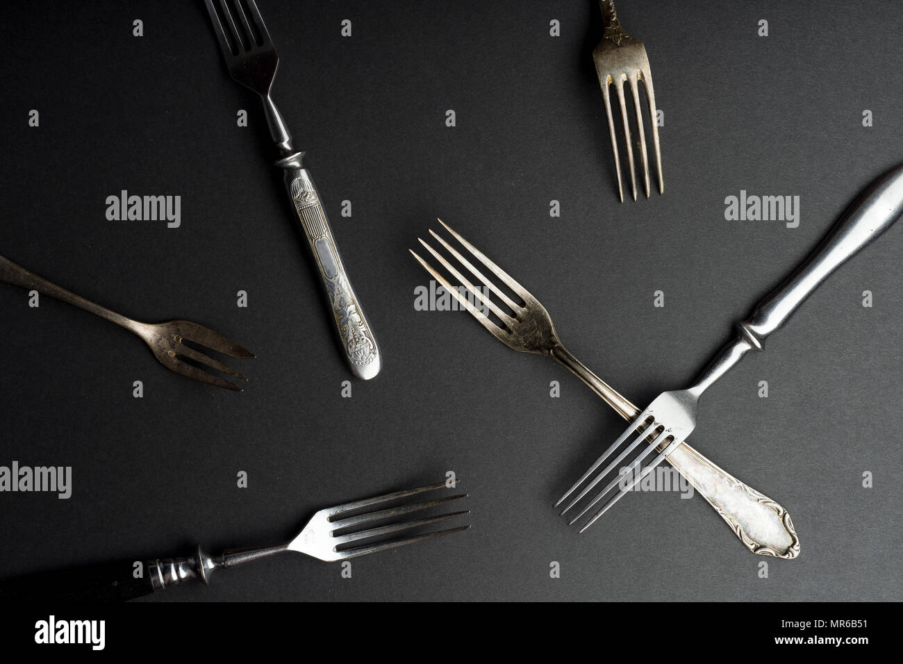 Vintage metallic cutlery and kitchen utensils on gray background Stock ...