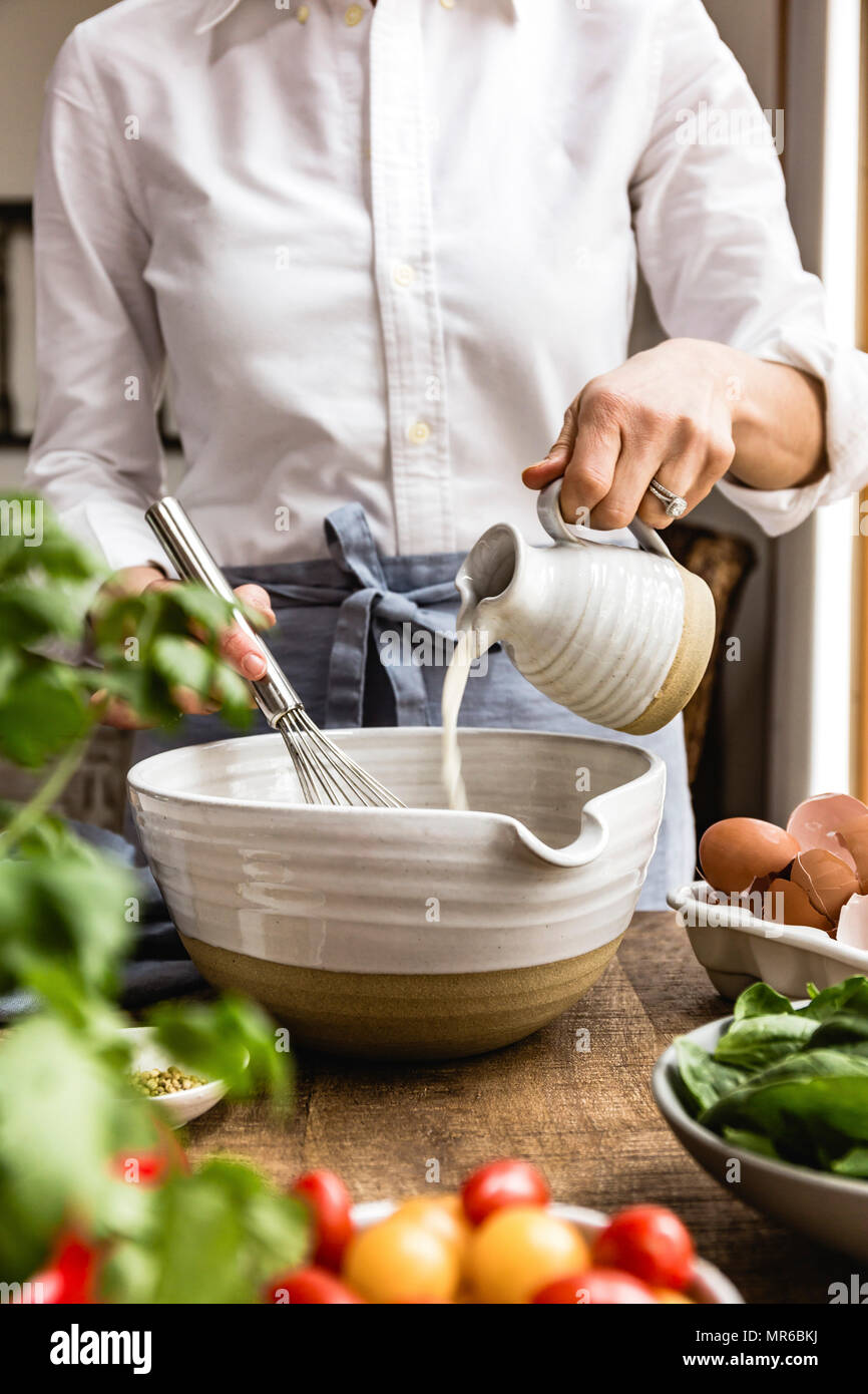 Woman mixing ingredients in hi-res stock photography and images - Alamy