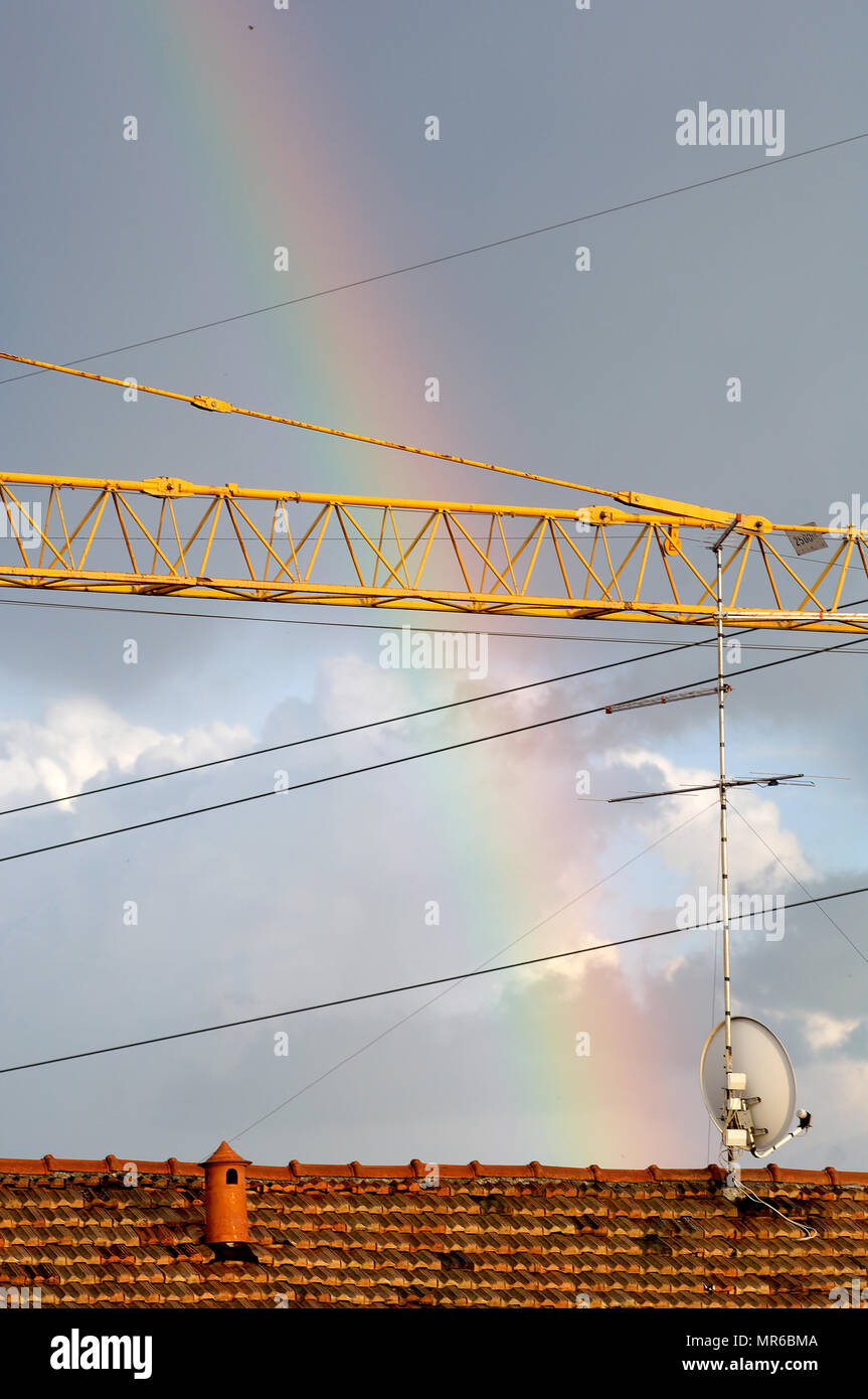 a rainbow in a construction side Stock Photo - Alamy
