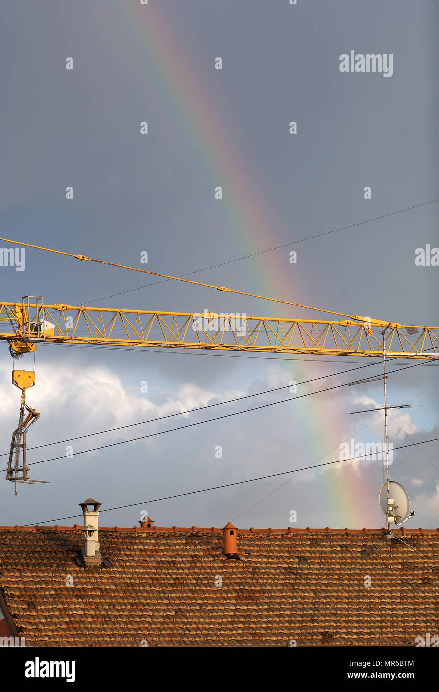 a rainbow in a construction side Stock Photo - Alamy
