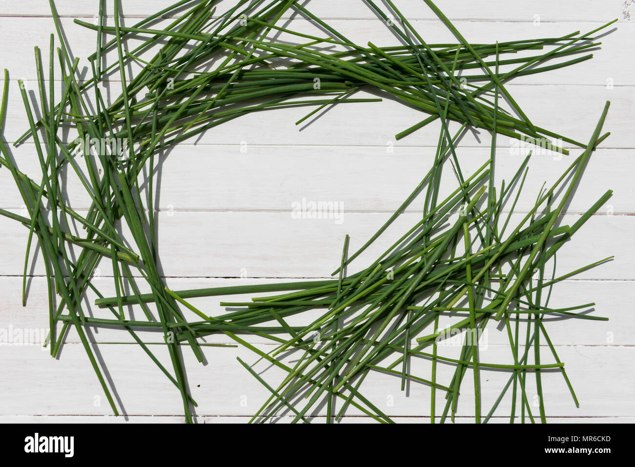 Fresh chive herbs on a white background Stock Photo - Alamy