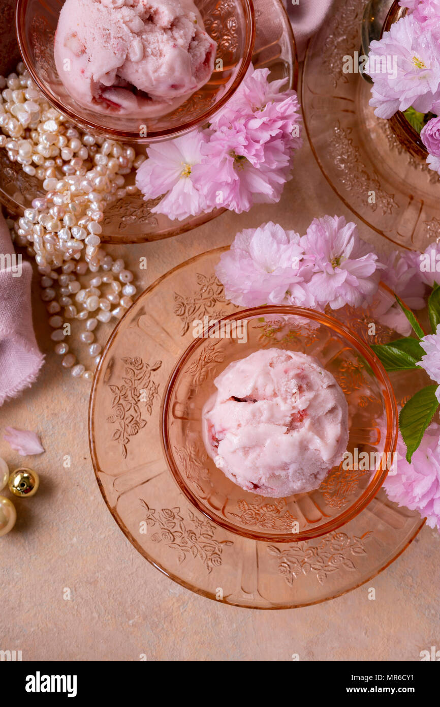 Strawberry Ice Cream alongside spring blossom Stock Photo - Alamy