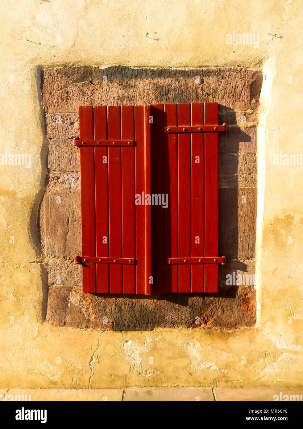 Red Shutters on Stucco Wall in Europe Stock Photo - Alamy