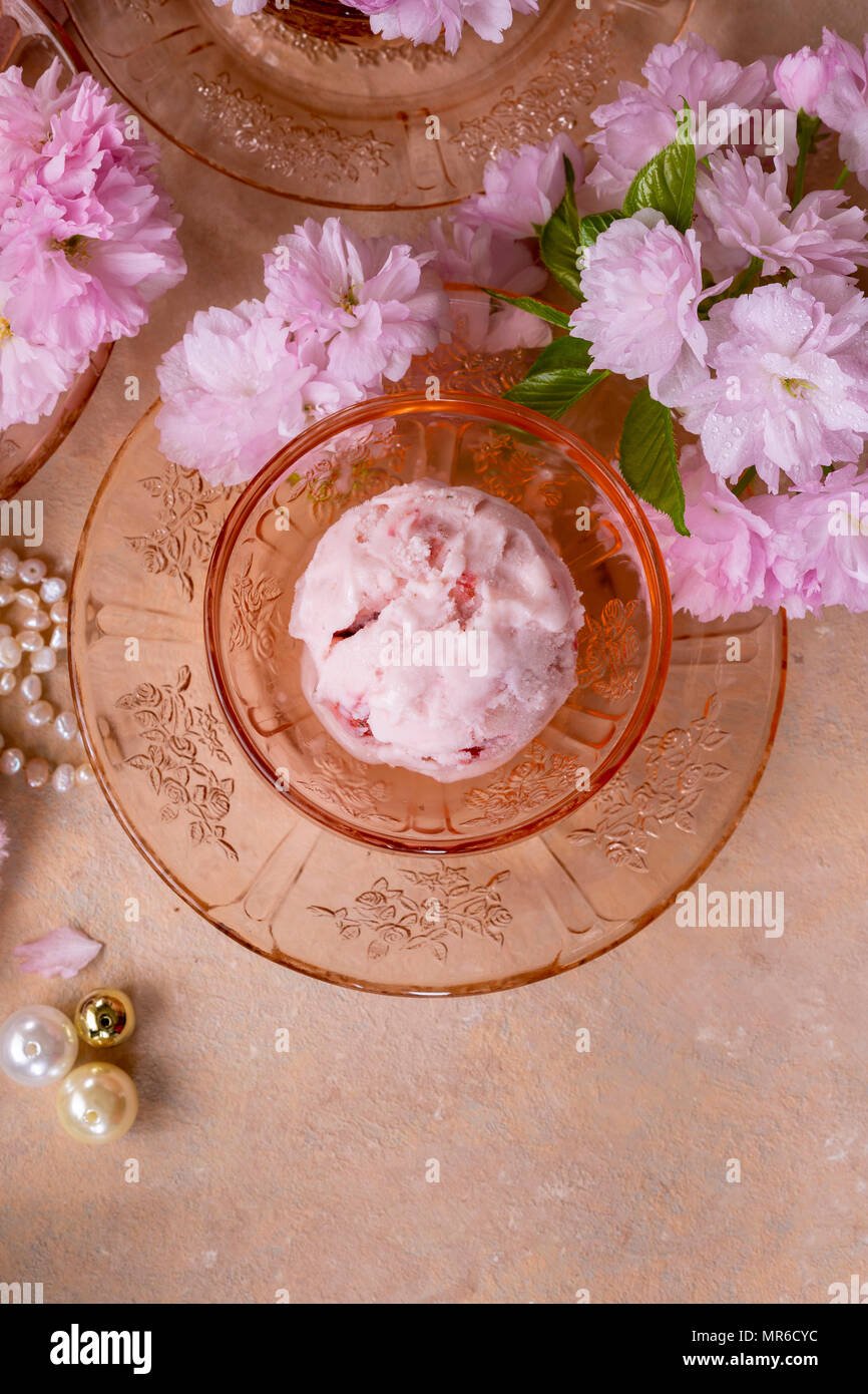 Strawberry Ice Cream alongside spring blossom Stock Photo - Alamy