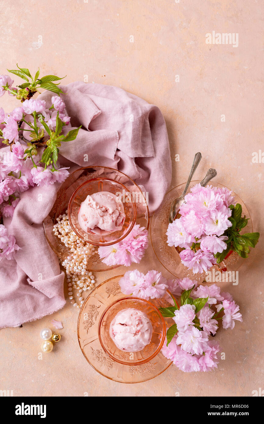 Strawberry Ice Cream alongside spring blossom Stock Photo - Alamy