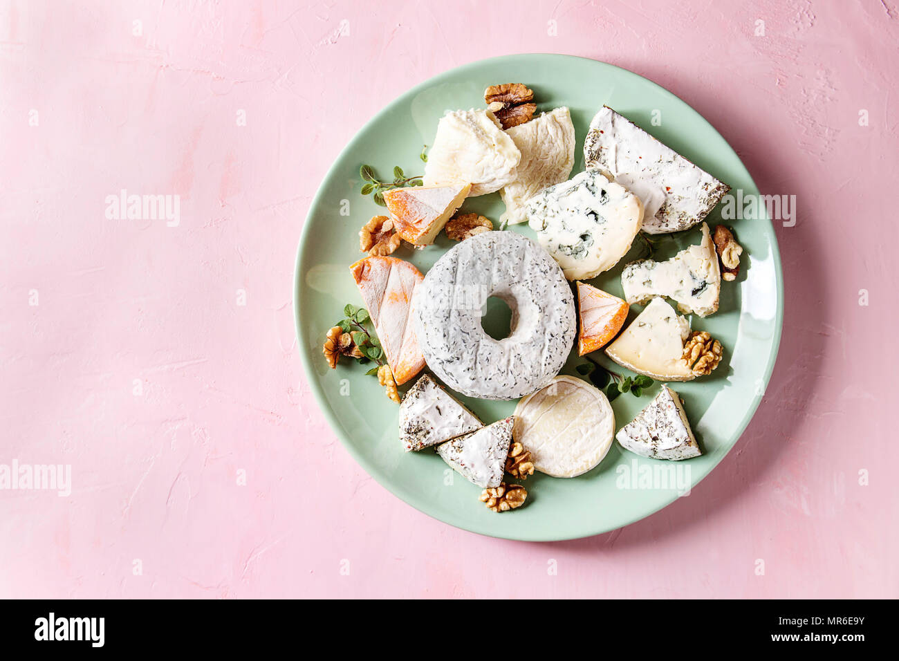 Cheese plate assortment of french cheese served with walnuts on ...