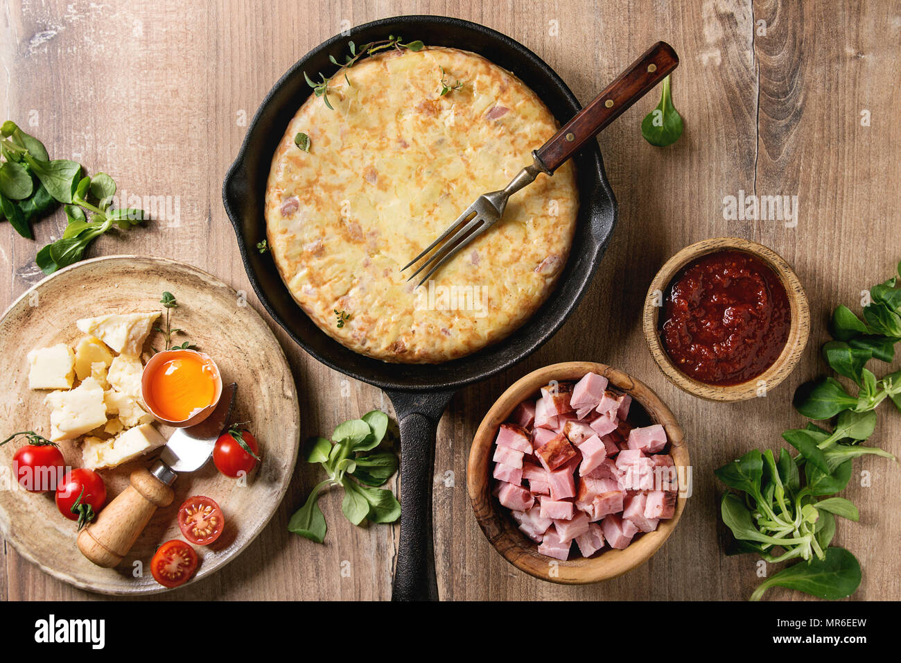 Spanish potato omelette tortilla with bacon served in cast-iron pan ...