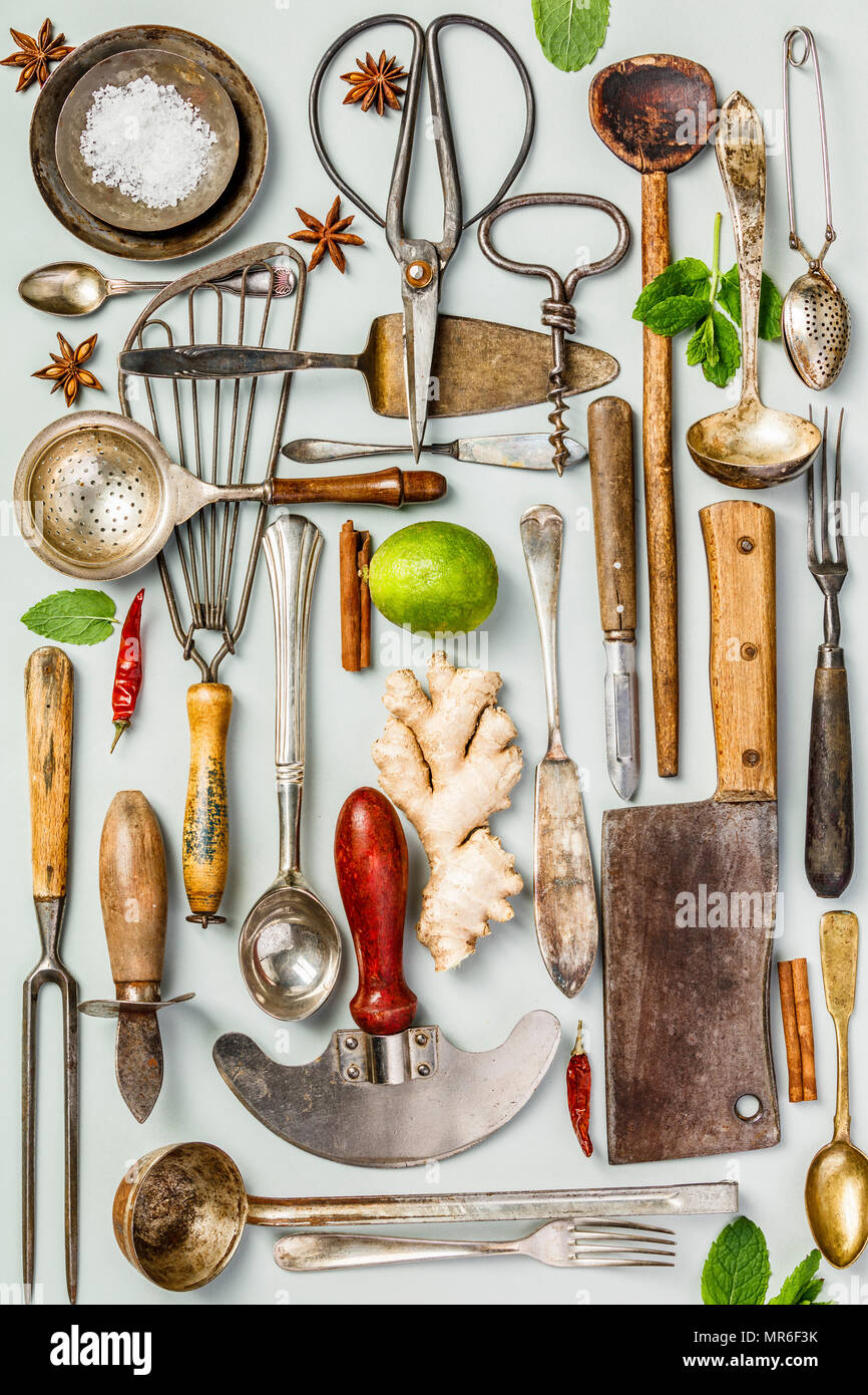 Collection of old vintage cutlery on grey background. Top view, flat ...