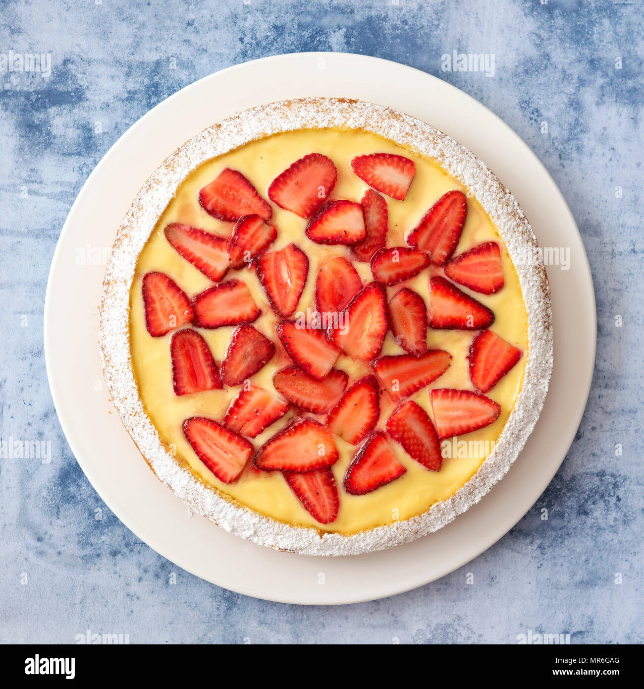 One large round strawberry custard dessert cake on a plate Stock Photo ...