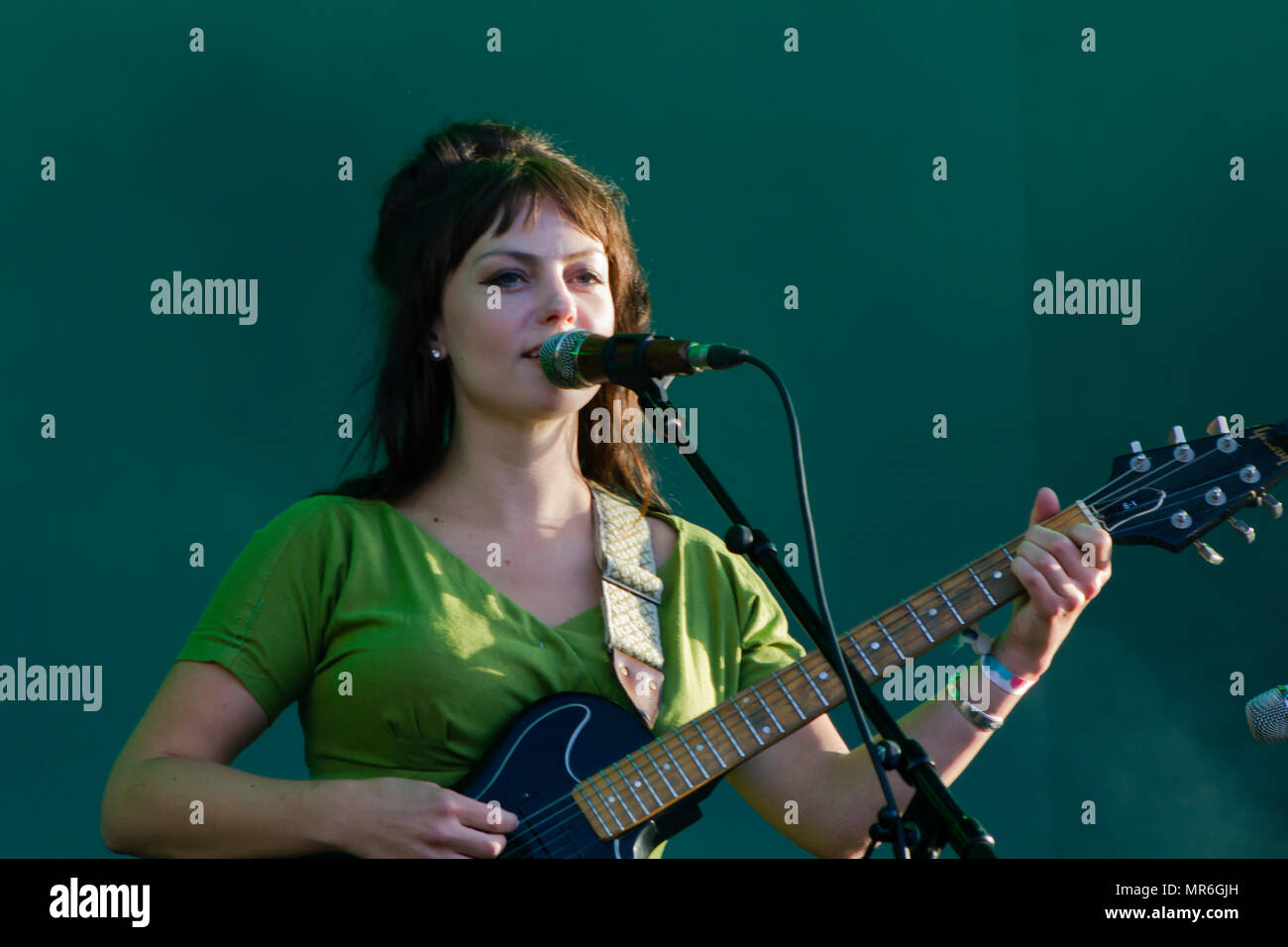 Celebrity music singing microphone playing guitar hi-res stock ...