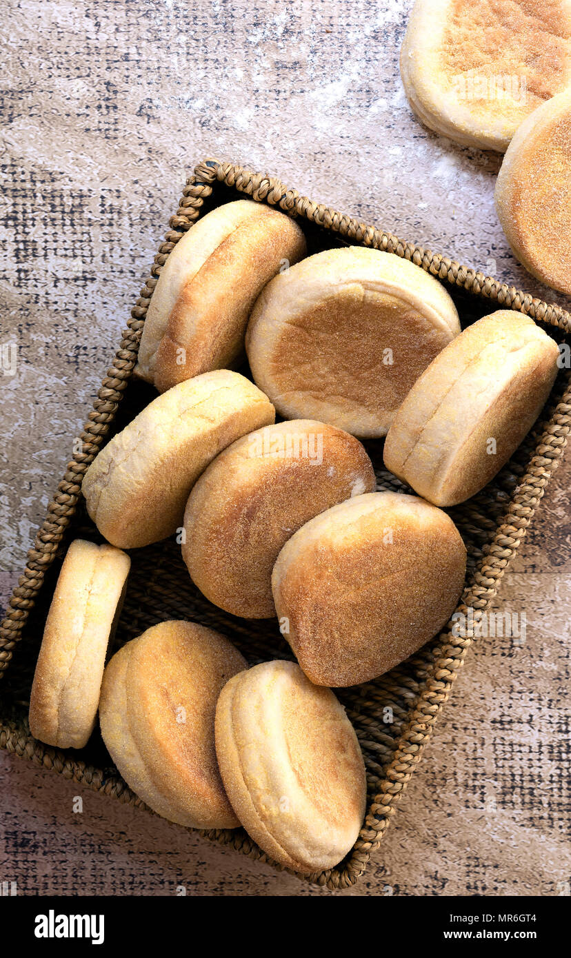 Rows of English muffins in a rectangular wicker basket Stock Photo - Alamy