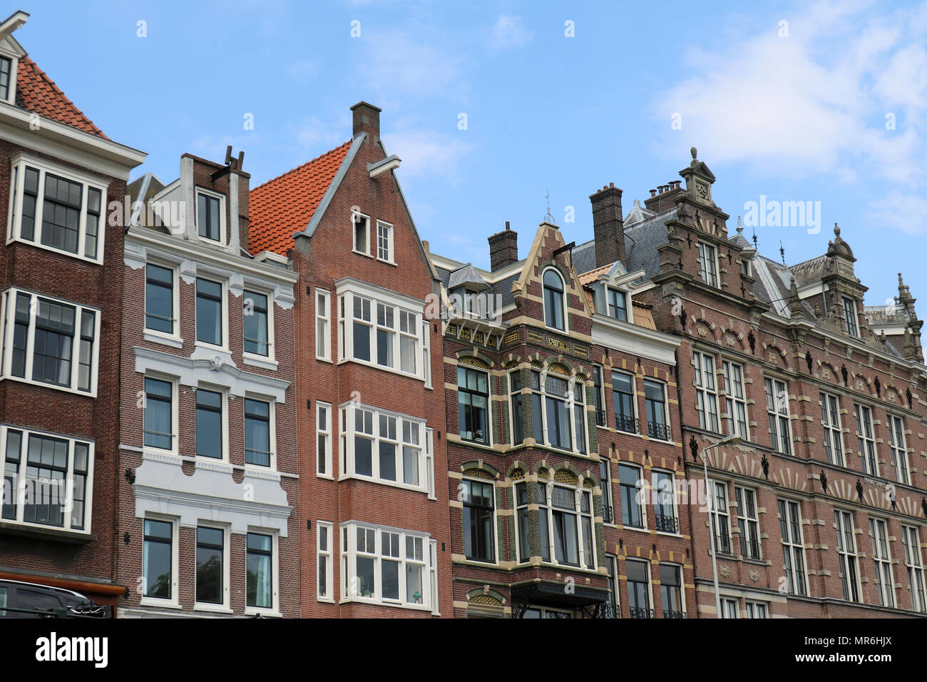 Traditional houses facades in Amsterdam with classic Dutch architecture ...