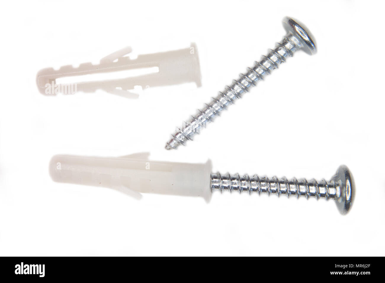 Screws and dowels on a white background Stock Photo - Alamy