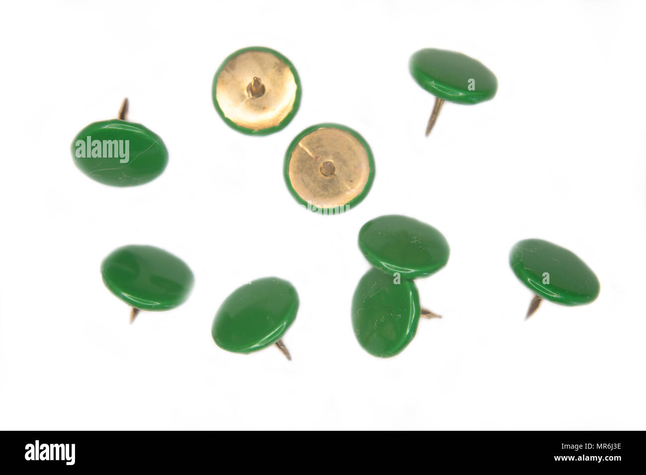 Thumbtacks on a white background viewed from near and from above Stock ...