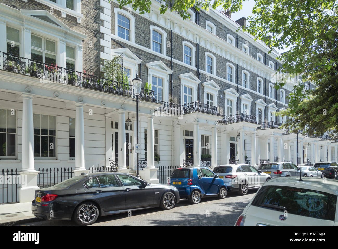 Stucco fronted terraced townhouses in Onslow Square, Kensington, London ...