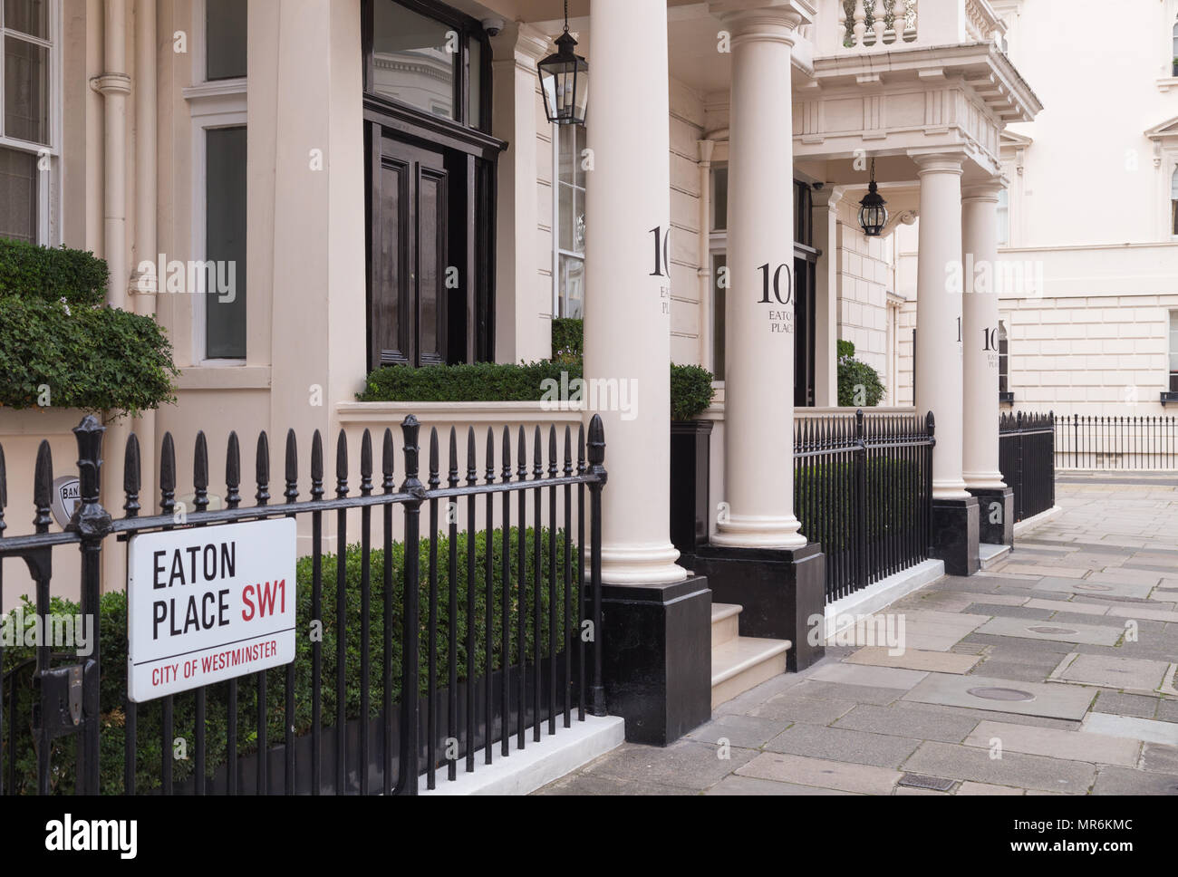 Luxury stucco townhouses with portico facades in Eaton Place, Belgravia ...