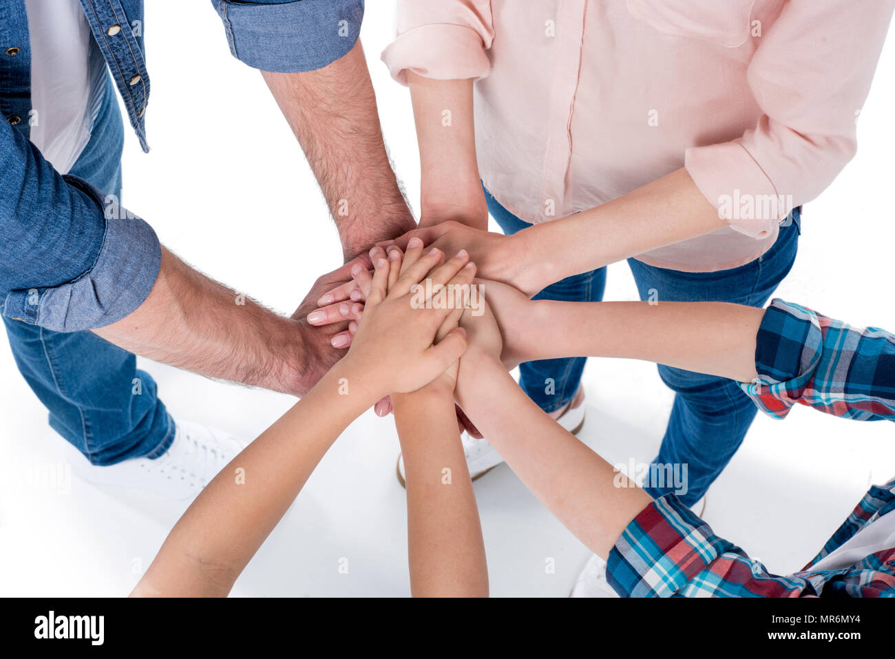 top view of family making pile of hands isolated on white Stock Photo ...