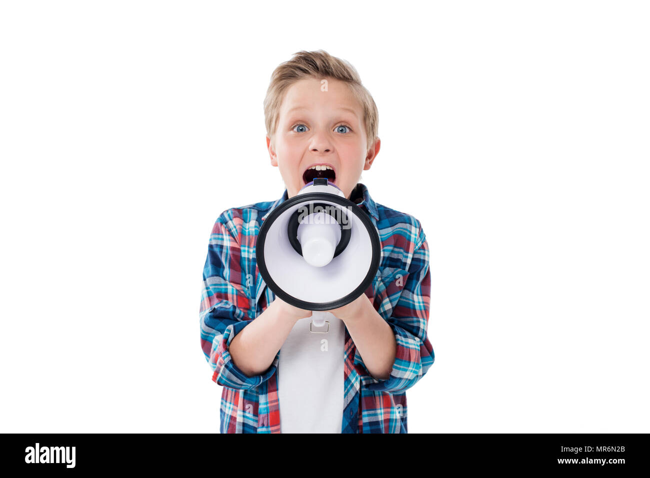 Cute little boy screaming in megaphone and looking at camera Stock ...