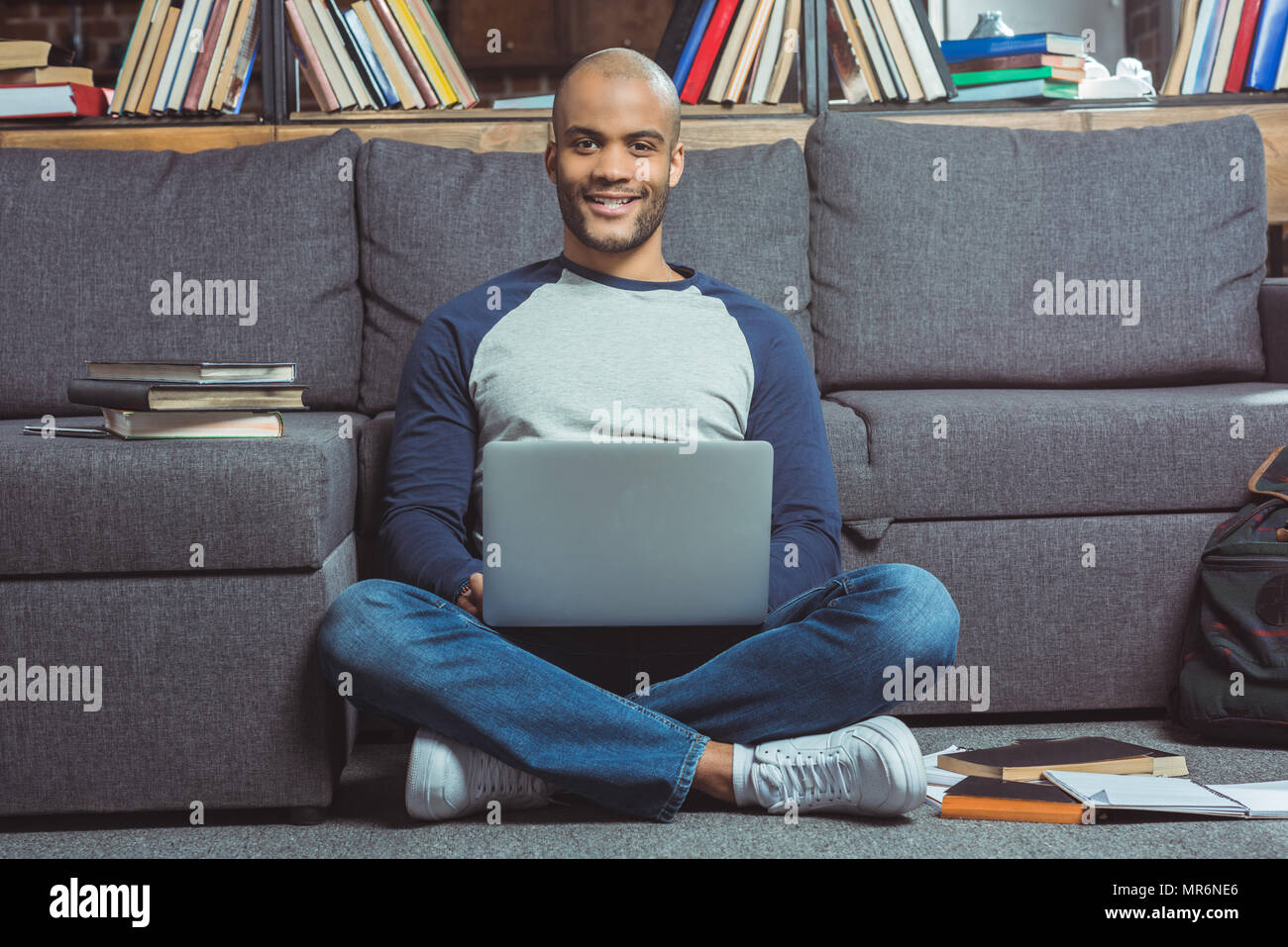 african american student using laptop and smiling at camera Stock Photo ...