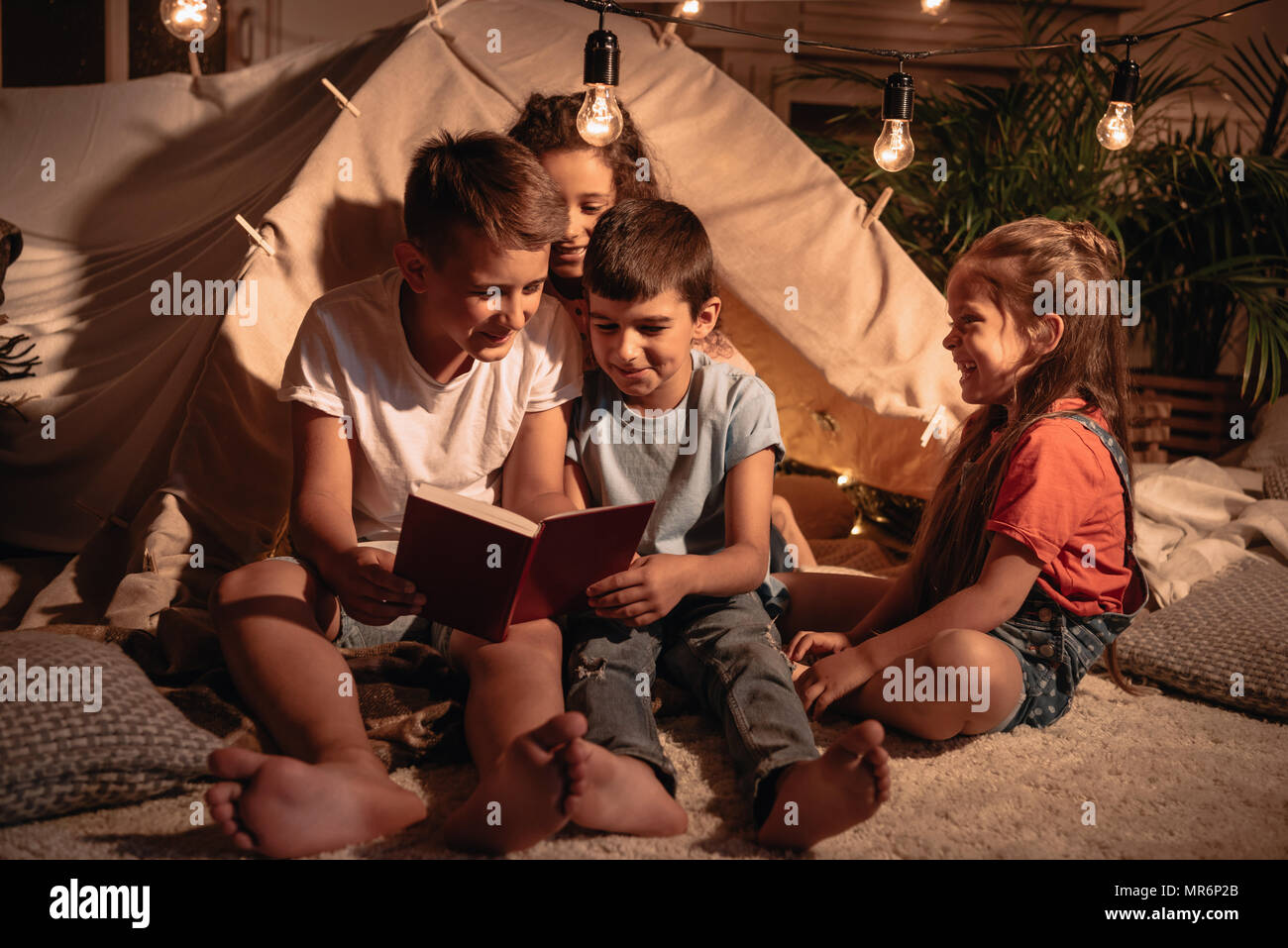Group of children tent reading hi-res stock photography and images - Alamy