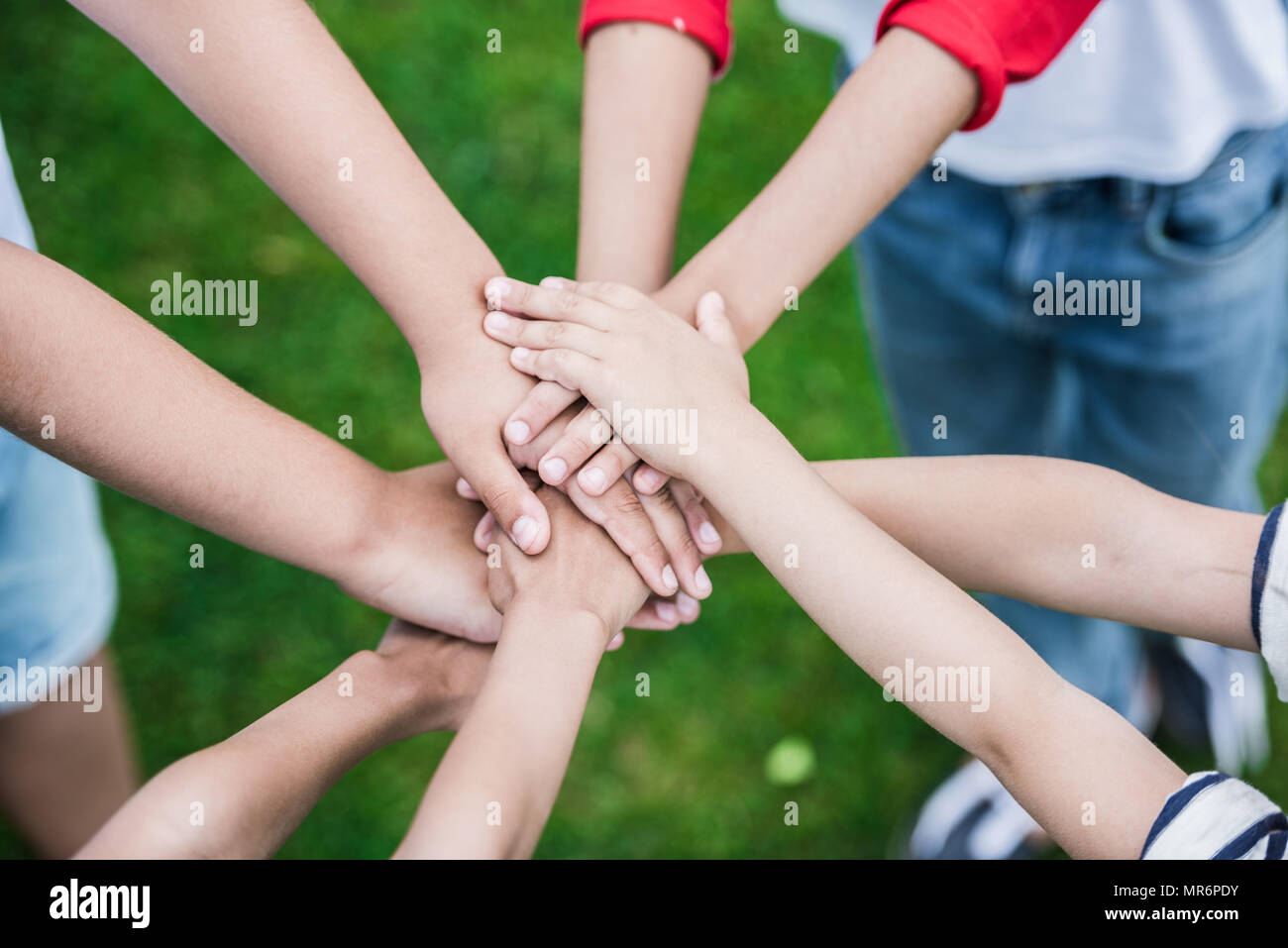 Group children hands up standing hi-res stock photography and images ...