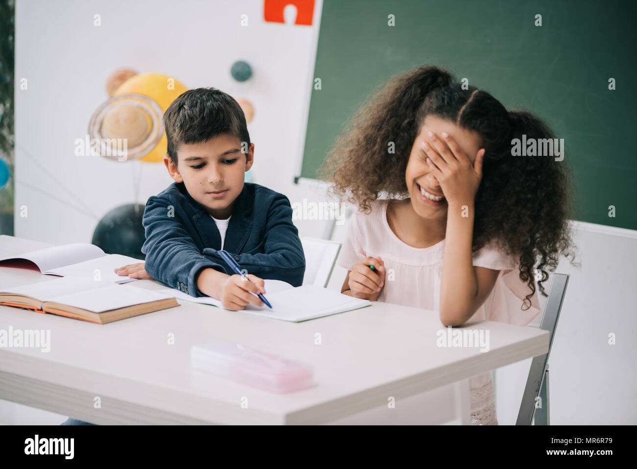 Student helping classmates hi-res stock photography and images - Alamy