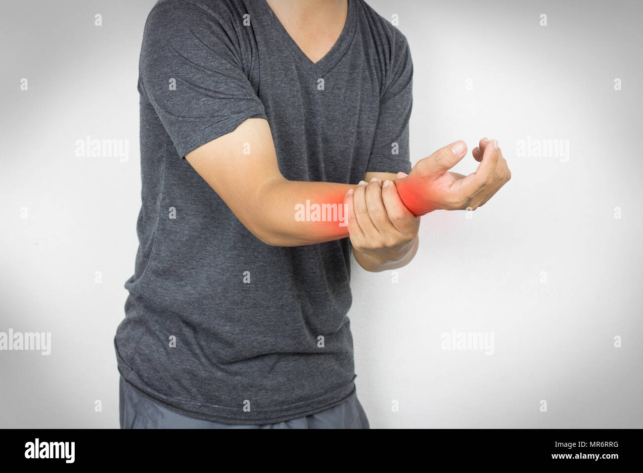 man holding arm ache, concept as health care Stock Photo - Alamy