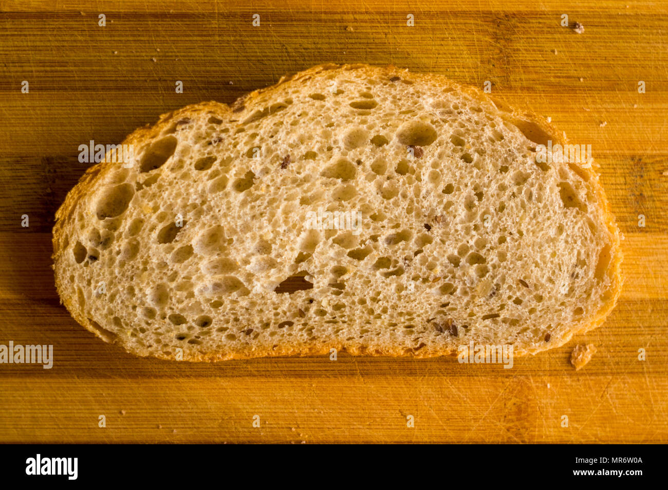 sliced whole wheat breads on a chopping Board Stock Photo - Alamy