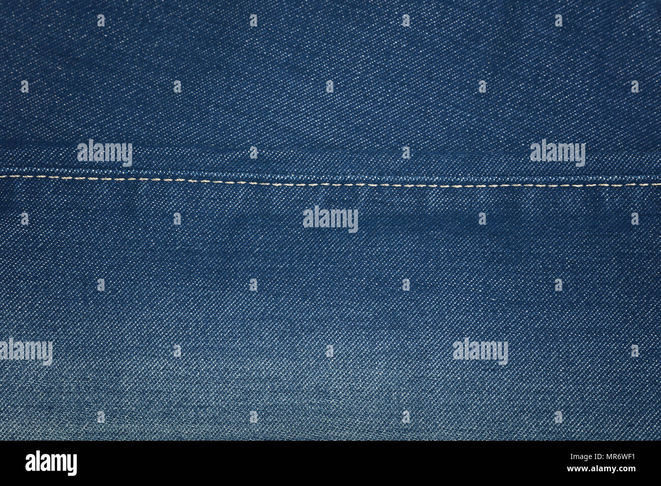 Dark indigo blue washed cotton jeans denim texture background with ...