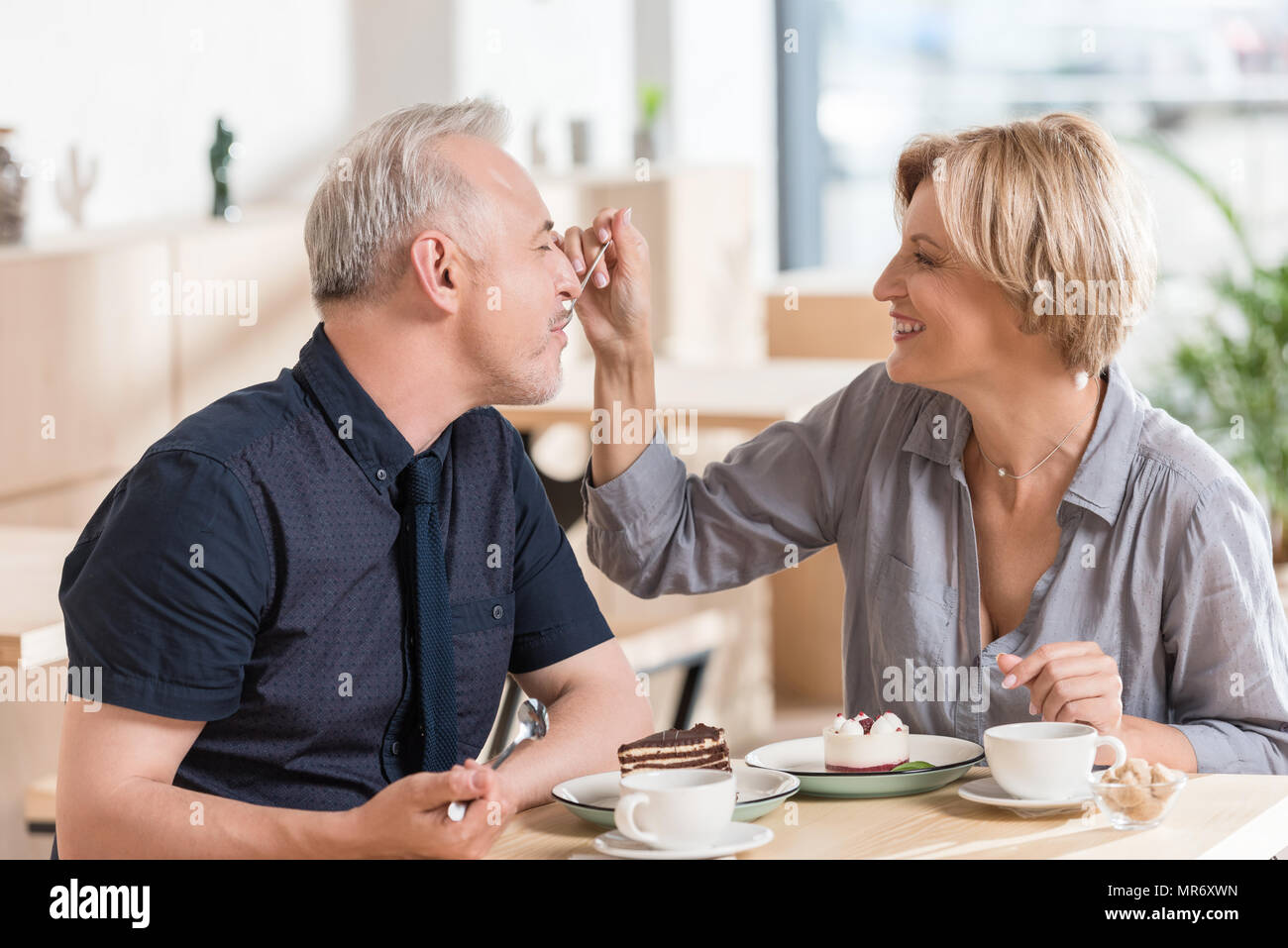 Adults eating sweets hi-res stock photography and images - Alamy