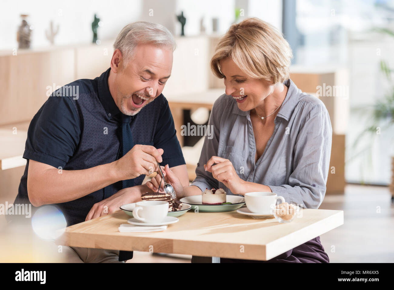 Woman eating sweets hi-res stock photography and images - Alamy