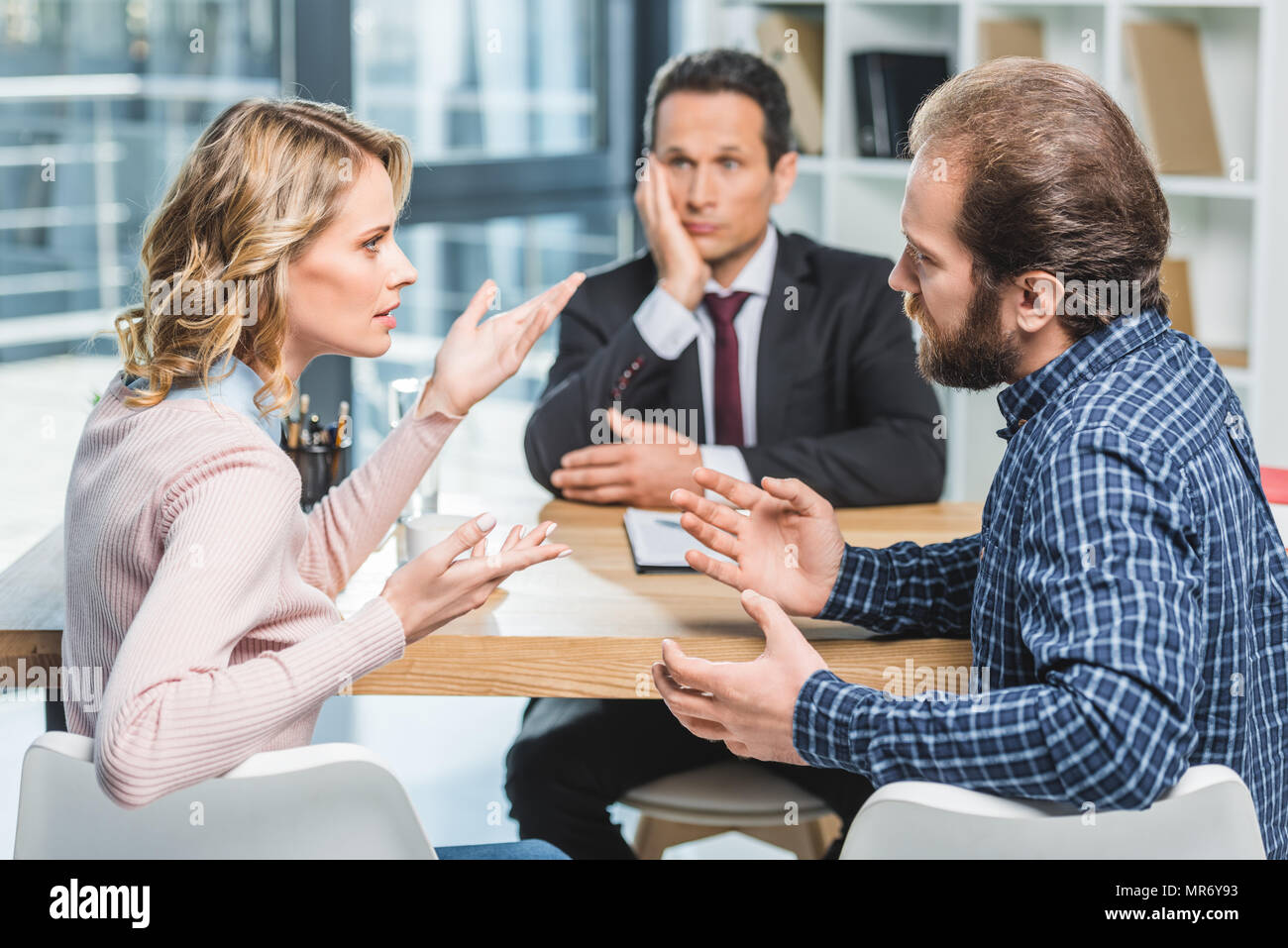 side view of couple arguing at workplace in lawyer office Stock Photo ...