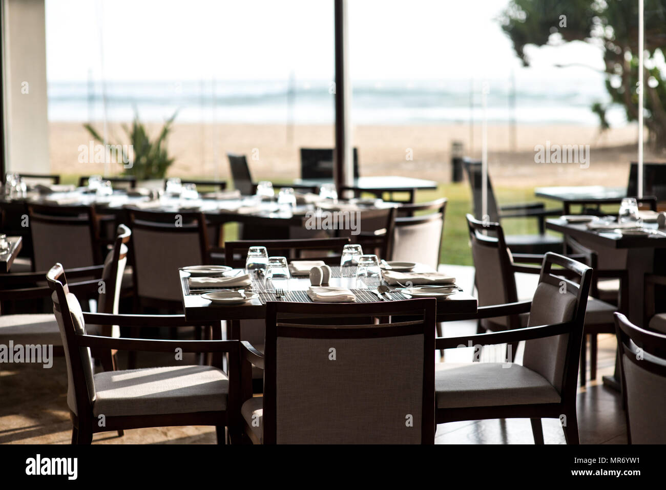 empty restaurant with served tables and seashore view from window Stock ...